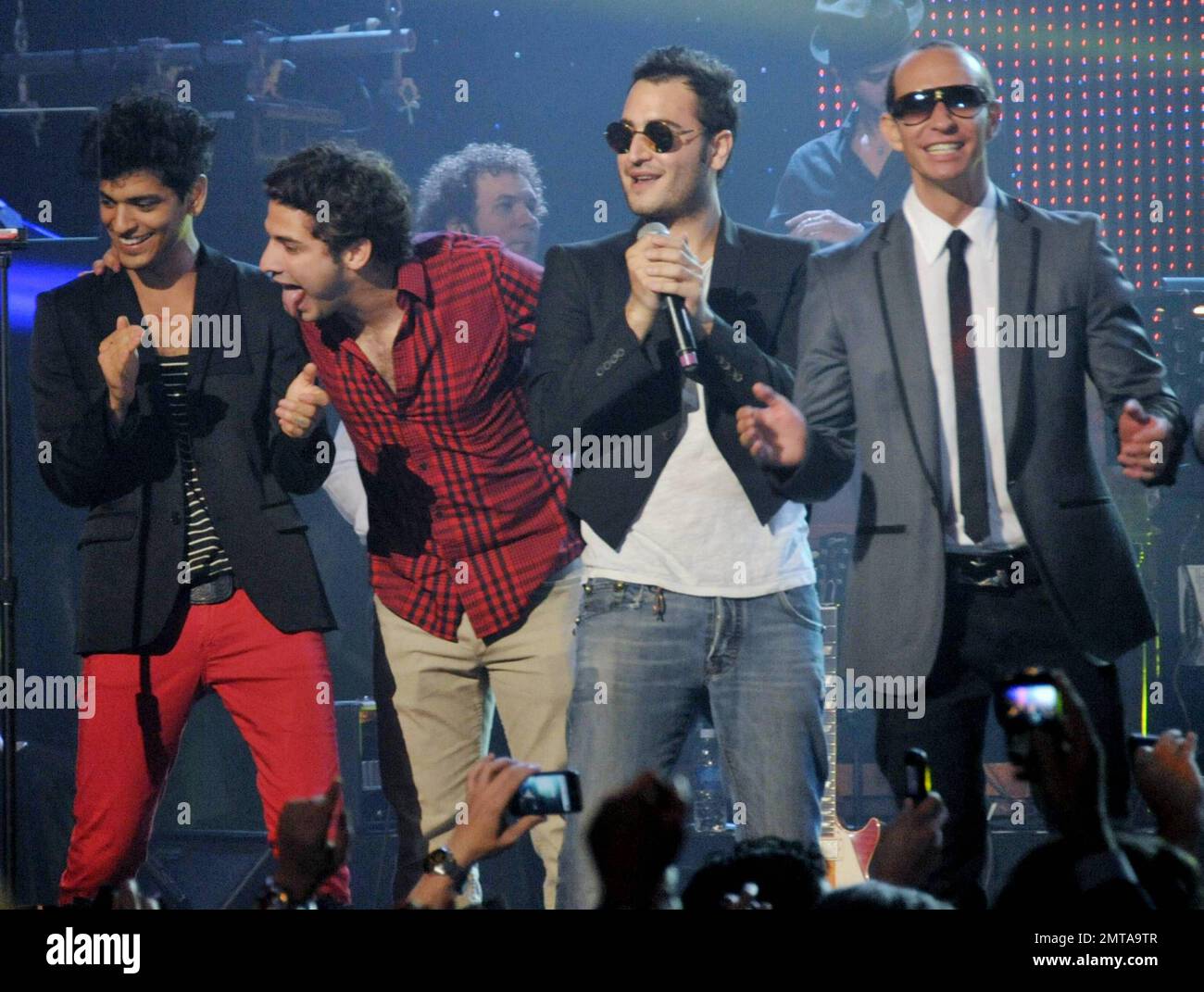 The band Reik and Eric Ruby (r) on stage during the Paulina Rubio and ...