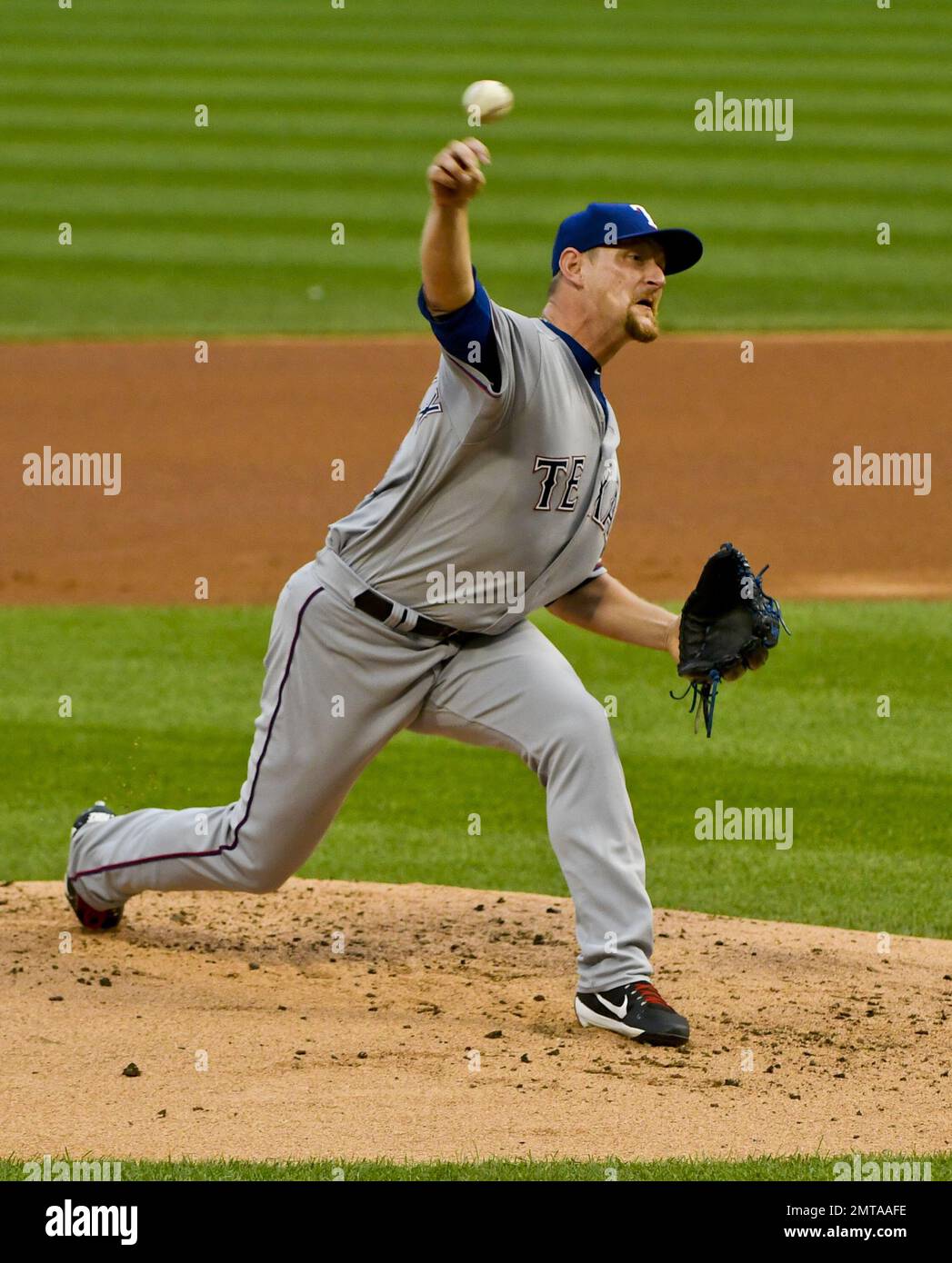 Texas Rangers starting pitcher Austin Bibens-Dirkx delivers against the ...