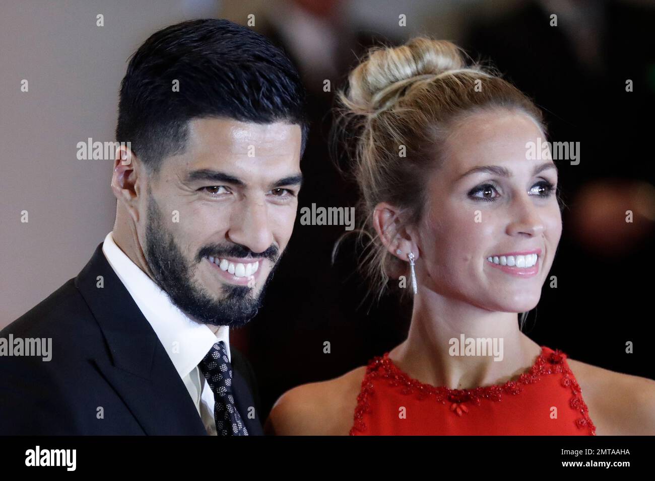 Uruguayan soccer star Luis Suarez and wife Sofia Balbi pose on the red ...