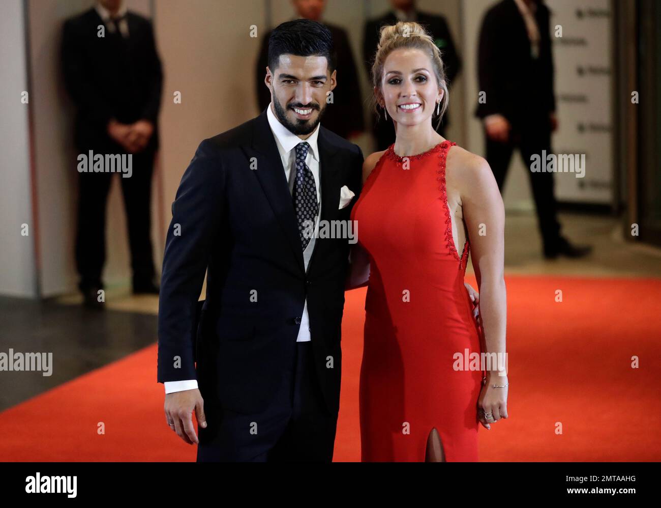 Uruguayan soccer star Luis Suarez and wife Sofia Balbi pose for photos ...