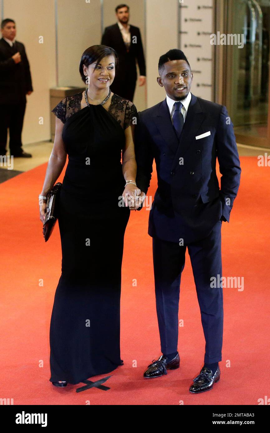 Samuel Eto'o, right, and wife Georgette pose for a photo as they arrive ...