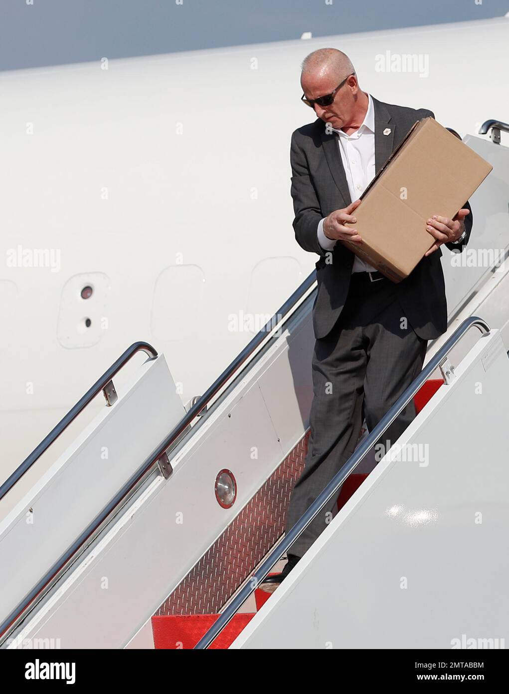 Director of Oval Office operations Keith Schiller carries a box as he ...
