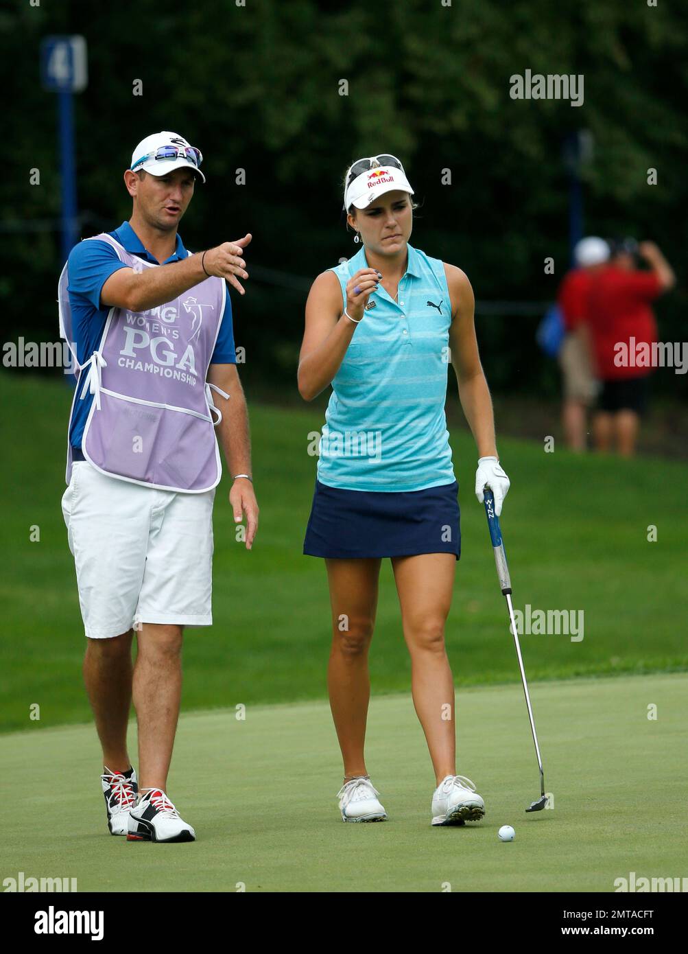 Lexi Thompson, right, talks with her caddie, Kevin McAlpine, on the ...