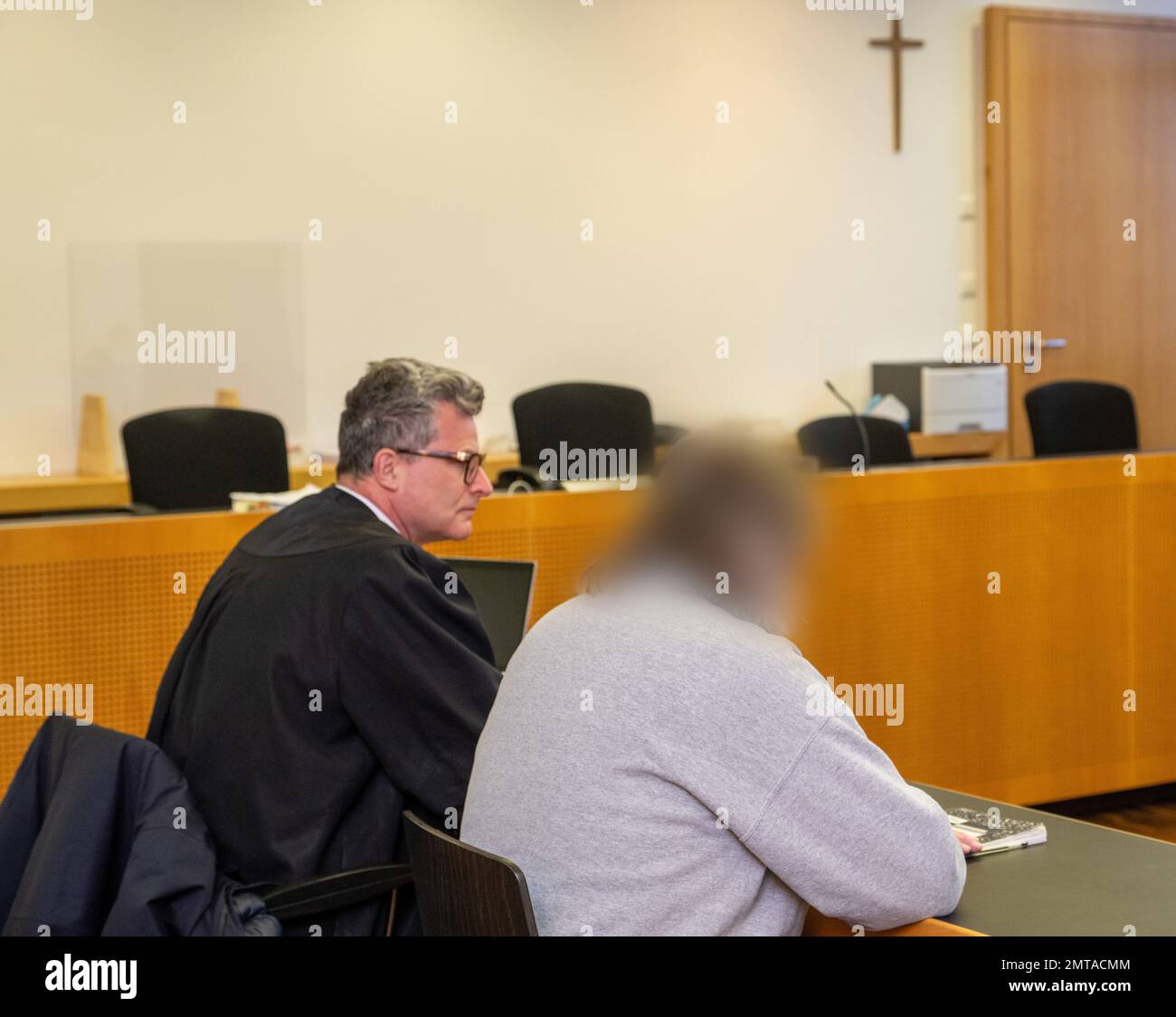 Augsburg, Germany. 01st Feb, 2023. The defendant (r) sits in the dock ...