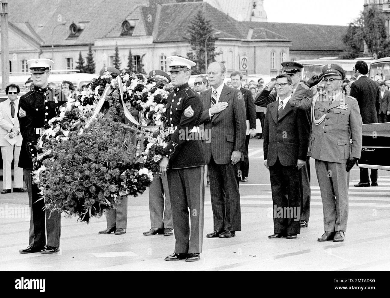 President Gerald Ford, with two U.S. Marines holding his wreath, stands ...