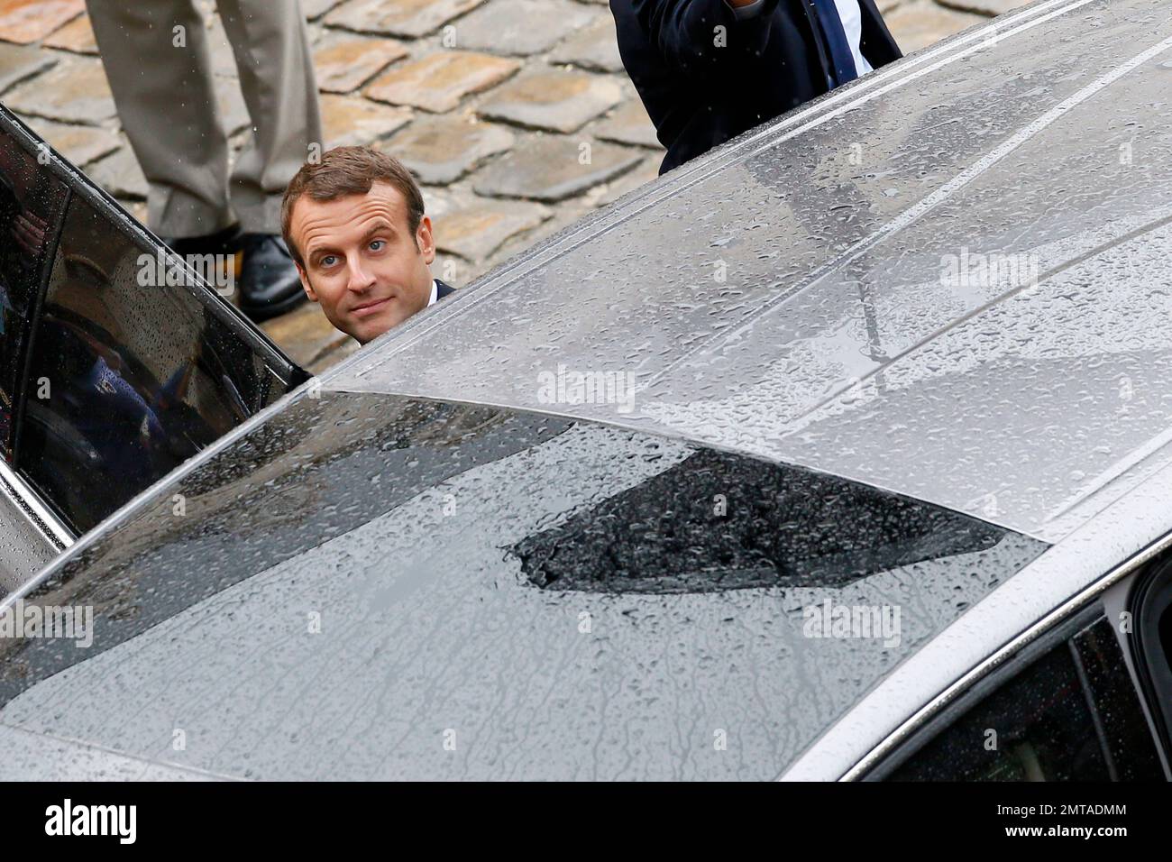 France's President Emmanuel Macron enters in his car after a military ...
