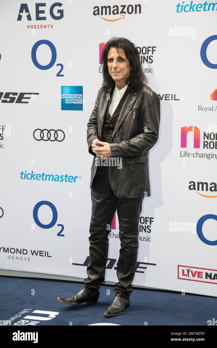 Rock singer Alice Cooper poses for photographers upon arrival at the ...