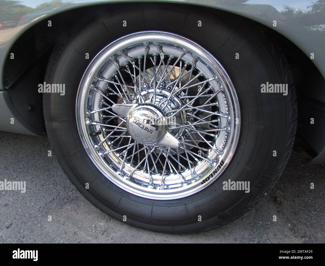 A closeup of a car rim spoked wheel detail of an Old Classic English ...