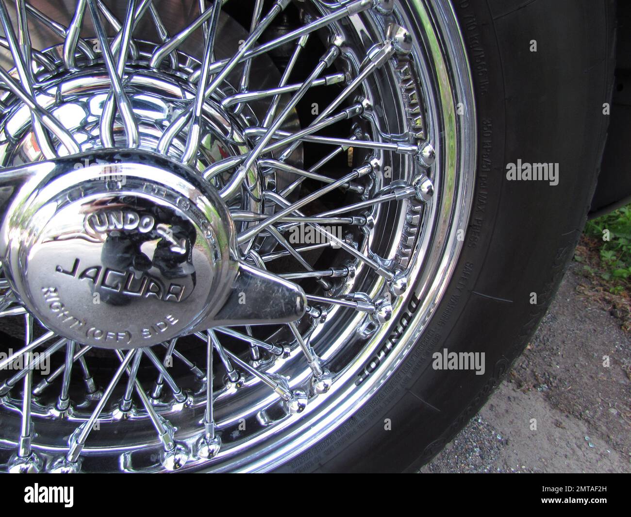 A closeup of a car rim spoked wheel detail of an Old Classic English ...