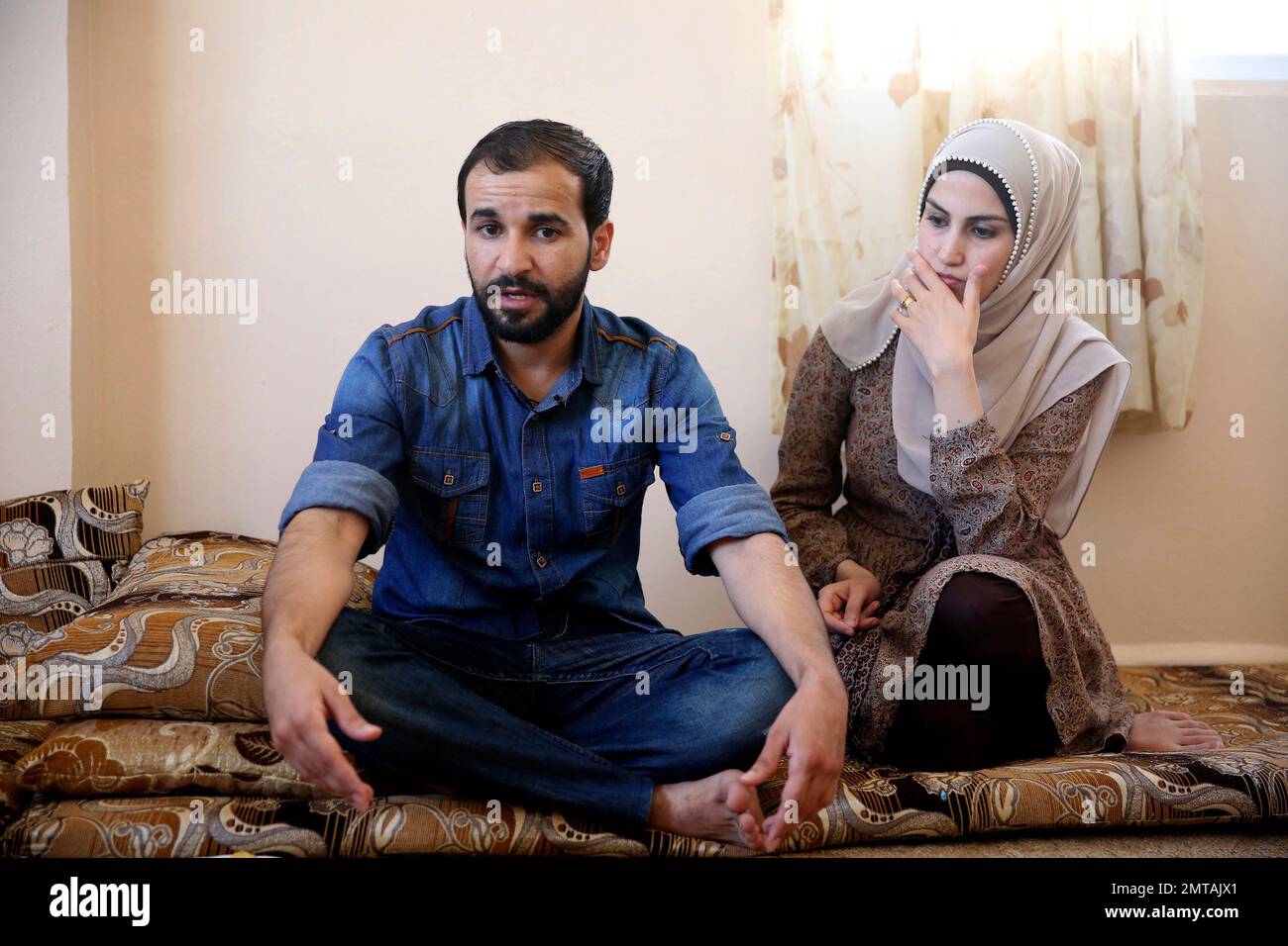 Mohammad al-Haj Ali, 28, and his wife Samah Hamidi, 25, pose for a ...
