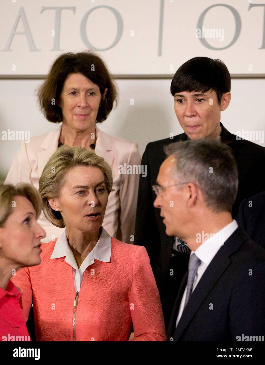 NATO Secretary General Jens Stoltenberg, front right, speaks with ...