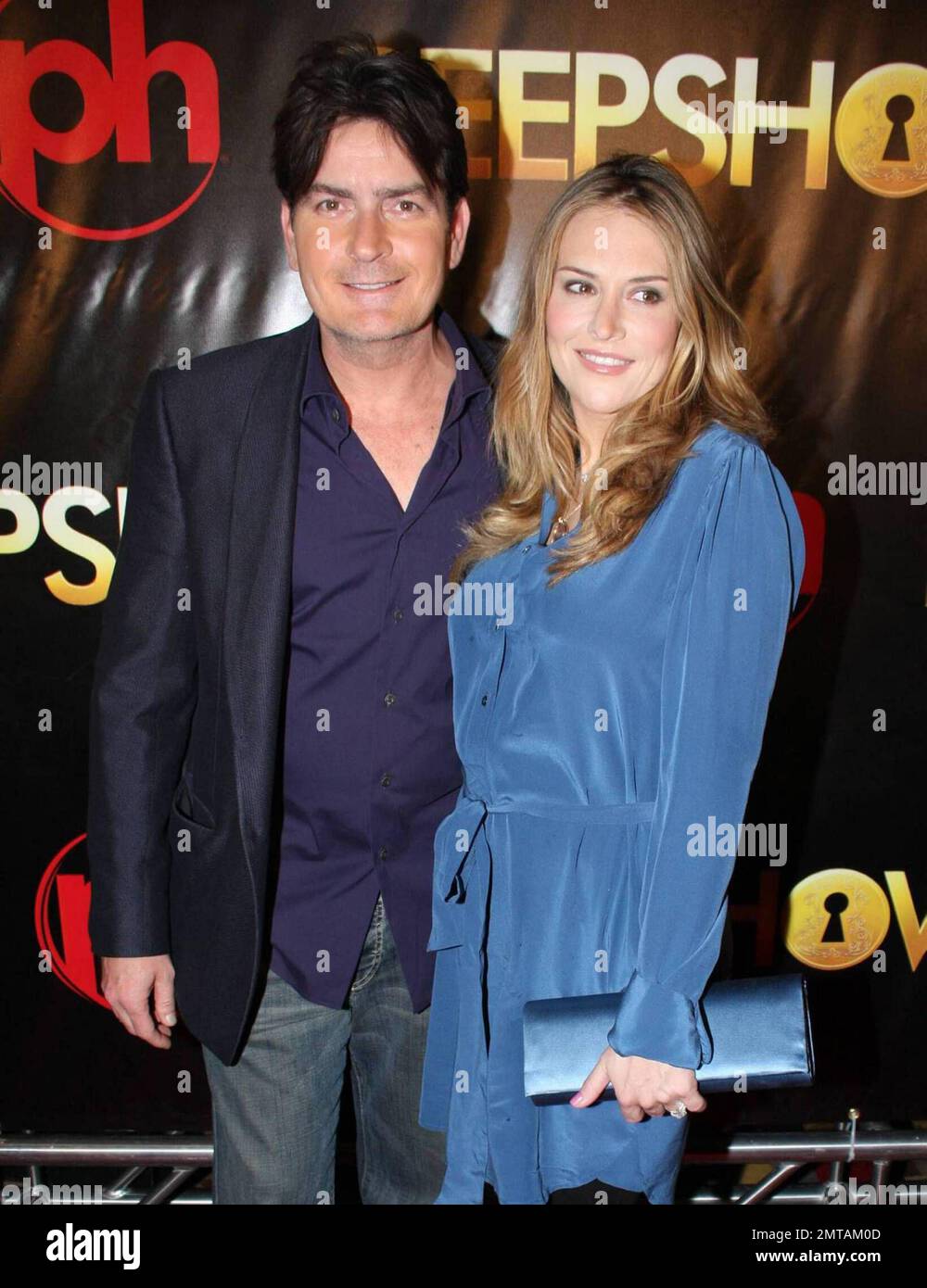 Charlie Sheen and his wife Brooke arrive at the Grand Opening of ...