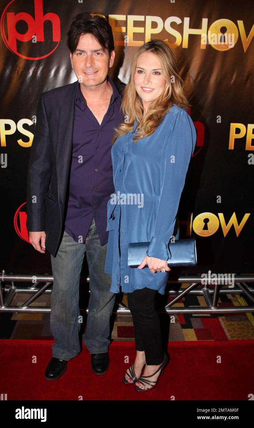 Charlie Sheen and his wife Brooke arrive at the Grand Opening of ...