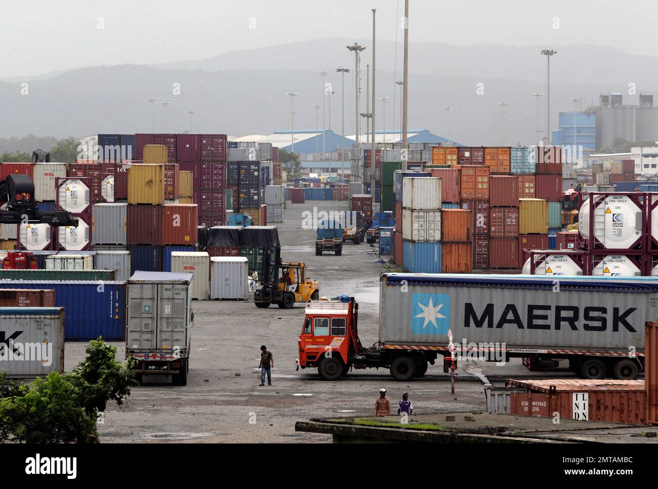 Containers are piled up at a terminal at the Jawaharlal Nehru Port ...