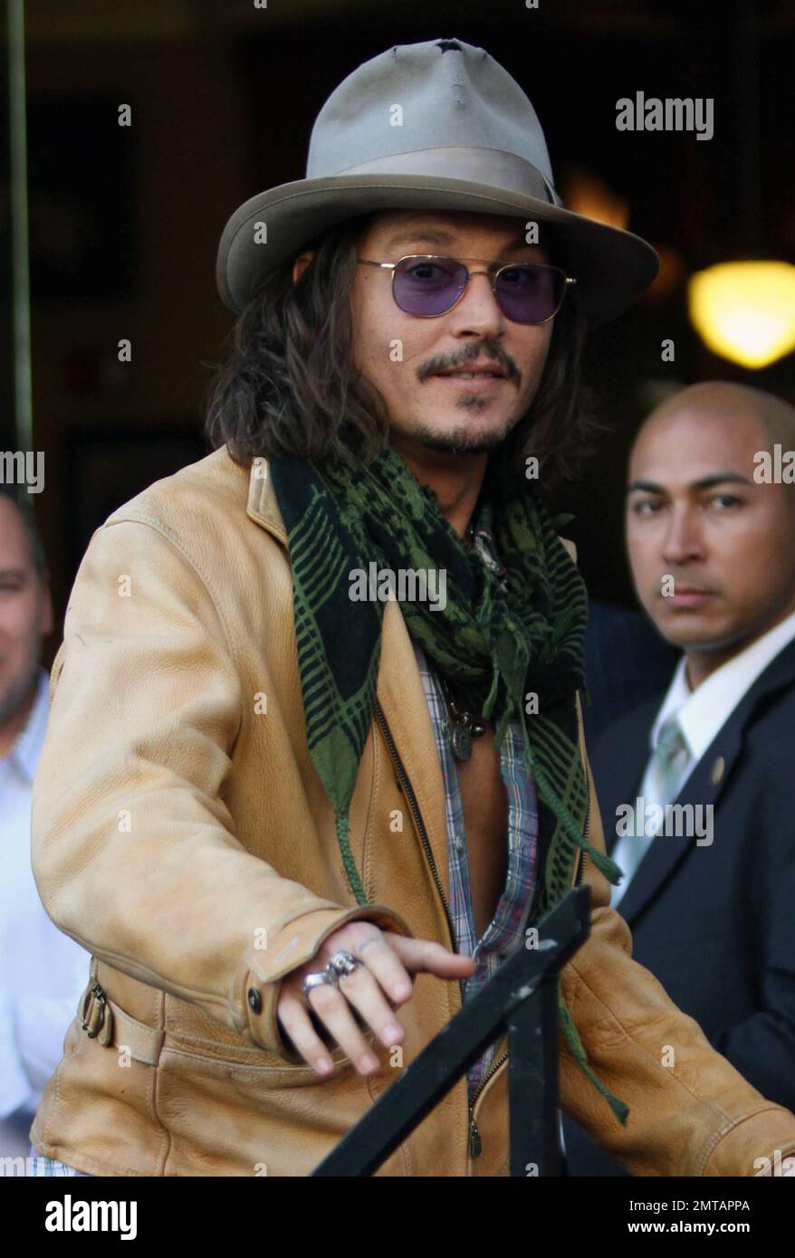 Actress Penelope Cruz wears a form-fitting purple dress showing off her ...