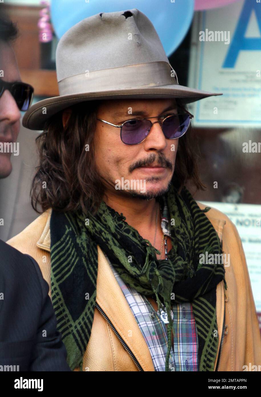 Actress Penelope Cruz wears a form-fitting purple dress showing off her ...