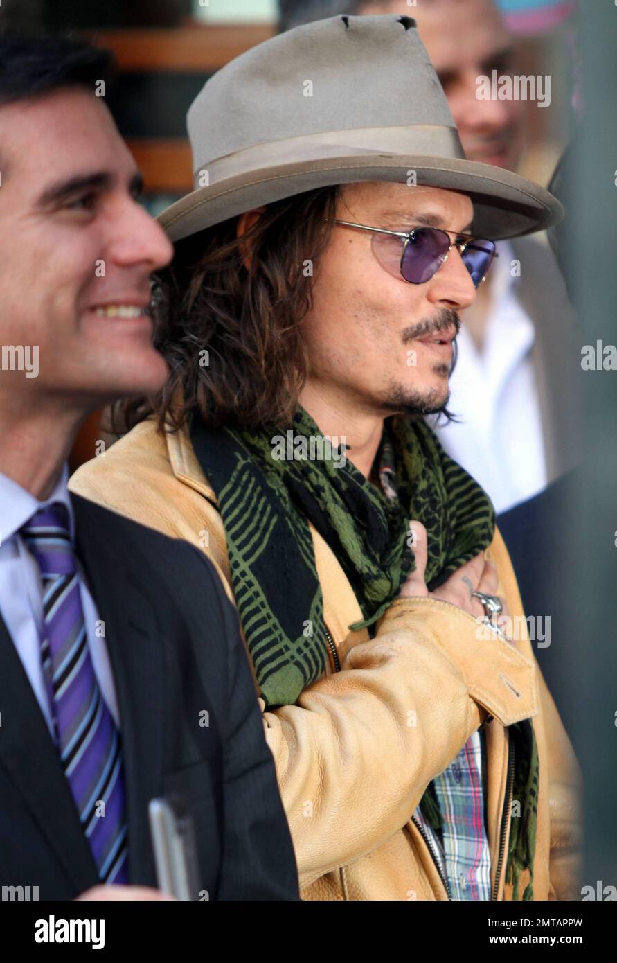 Actress Penelope Cruz wears a form-fitting purple dress showing off her ...