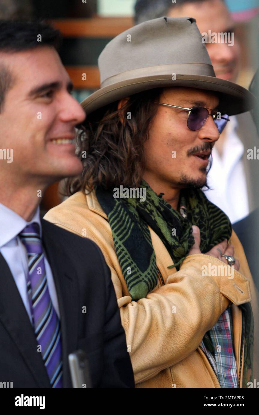 Actress Penelope Cruz wears a form-fitting purple dress showing off her ...