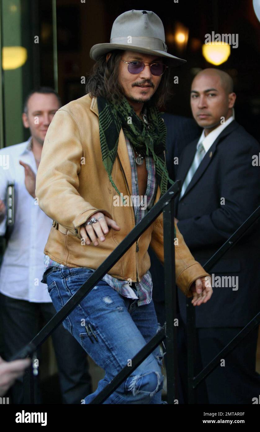 Actress Penelope Cruz wears a form-fitting purple dress showing off her ...