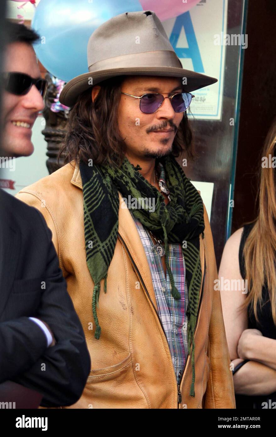 Actress Penelope Cruz wears a form-fitting purple dress showing off her ...