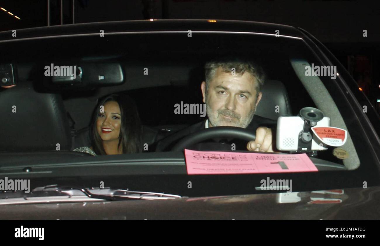 Shay Mitchell greets a fan from her car at the People's Choice Awards ...