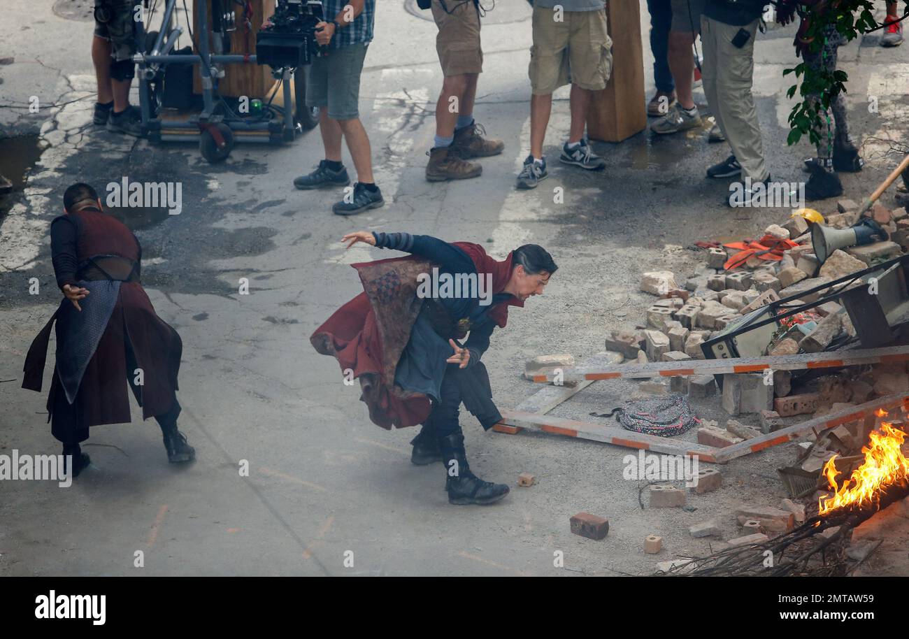 Cast members Benedict Wong and Benedict Cumberbatch, from left, work ...