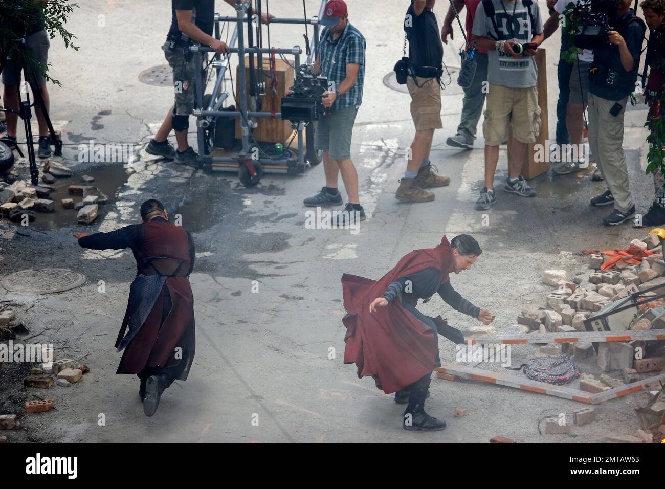 Cast members Benedict Wong and Benedict Cumberbatch, from left, work ...