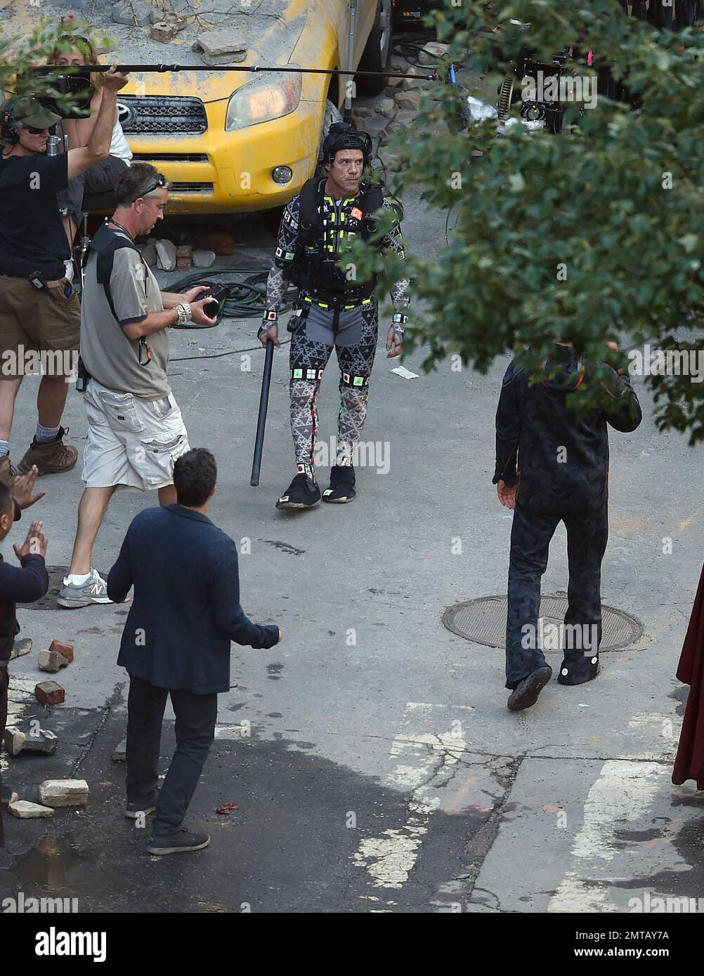 Cast members including Terry Notary, in a motion capture suit, top ...