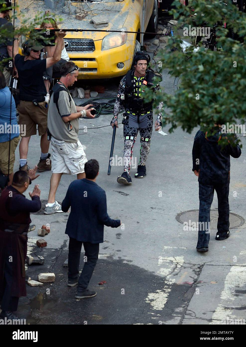 Cast members including Terry Notary, in a motion capture suit, top ...