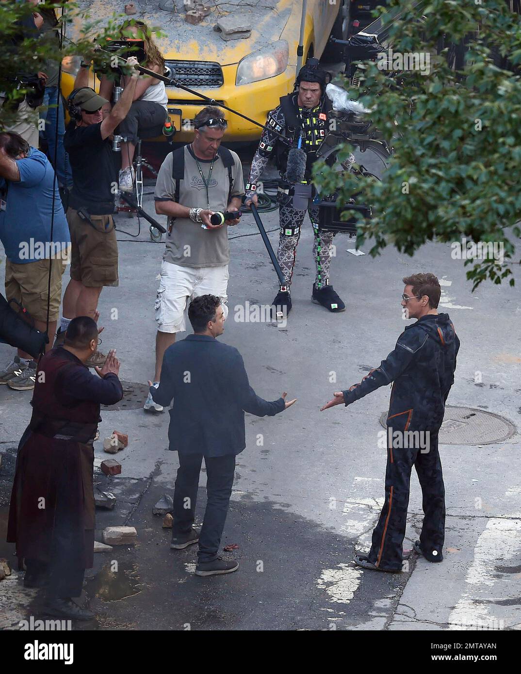 Cast members including Terry Notary, in a motion capture suit, top ...