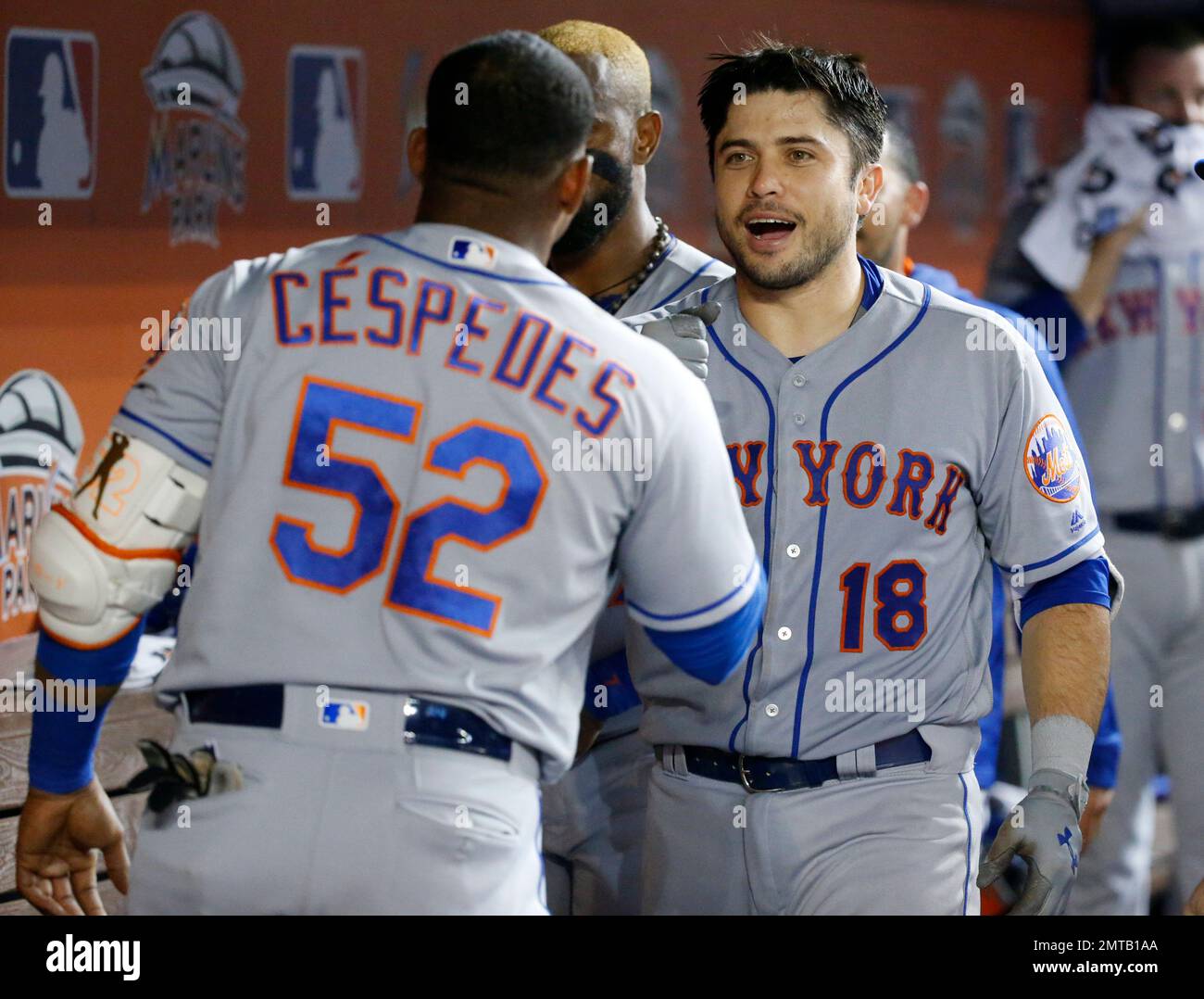 New York Mets' Travis d'Arnaud (18) is congratulated by Yoenis Cespedes ...