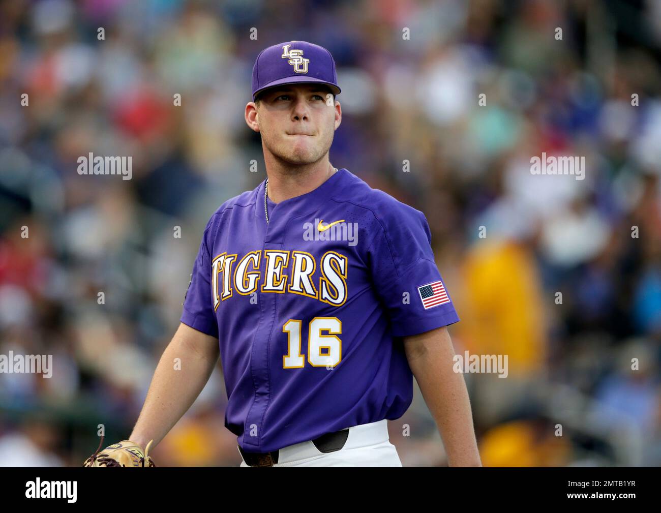 LSU pitcher Jared Poche' looks toward the scoreboard as he walks off ...