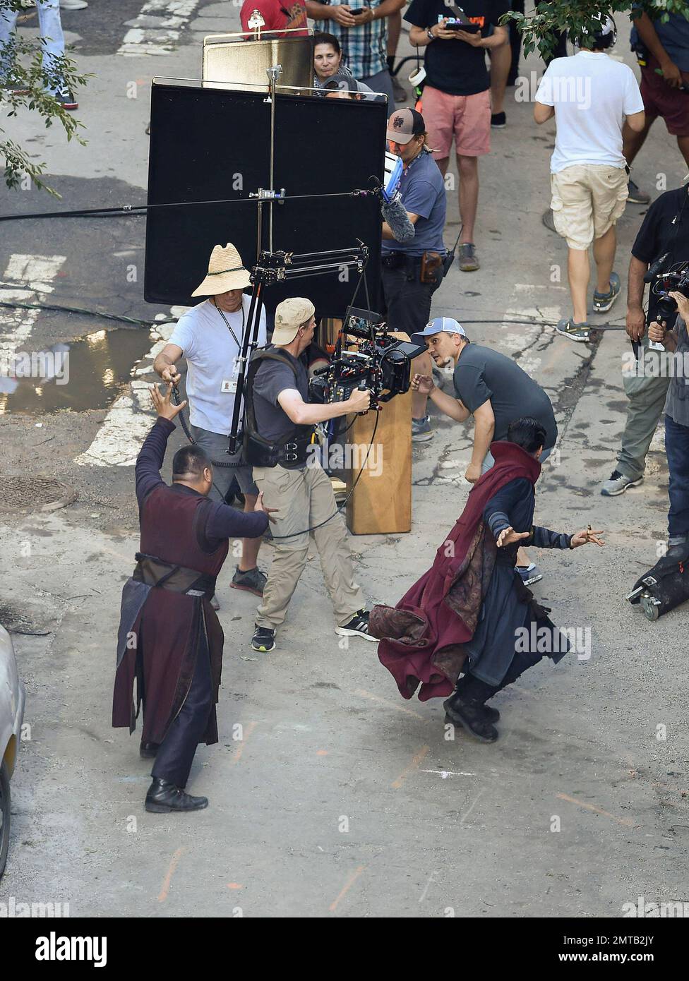 Cast members Benedict Wong and Benedict Cumberbatch, from left, work ...