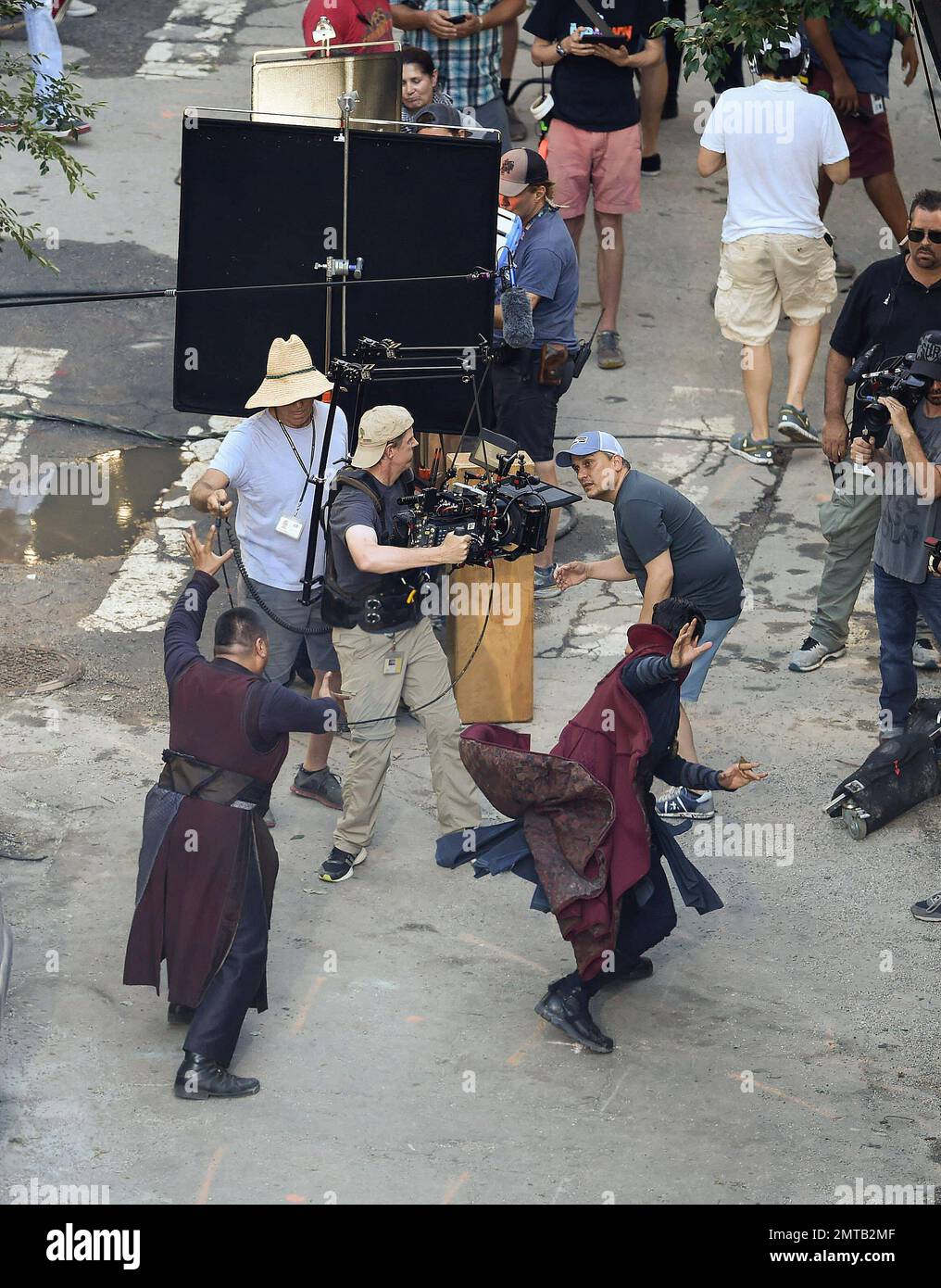 Cast members Benedict Wong and Benedict Cumberbatch, from left, work ...