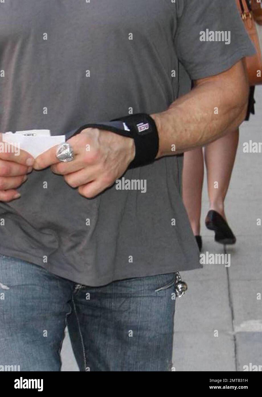Actor Sylvester Stallone wears a brace around his wrist and thumb to ...