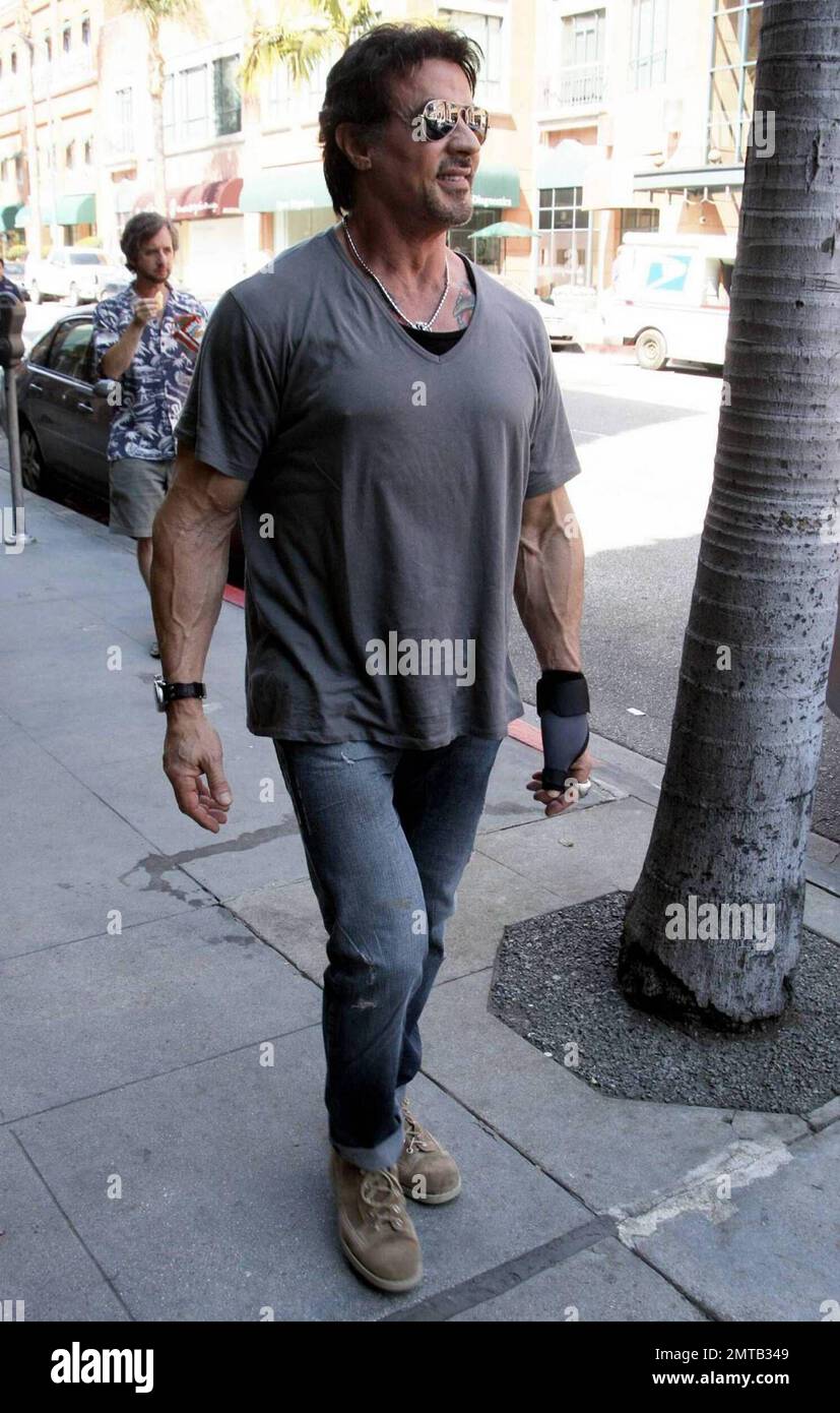 Actor Sylvester Stallone wears a brace around his wrist and thumb to ...