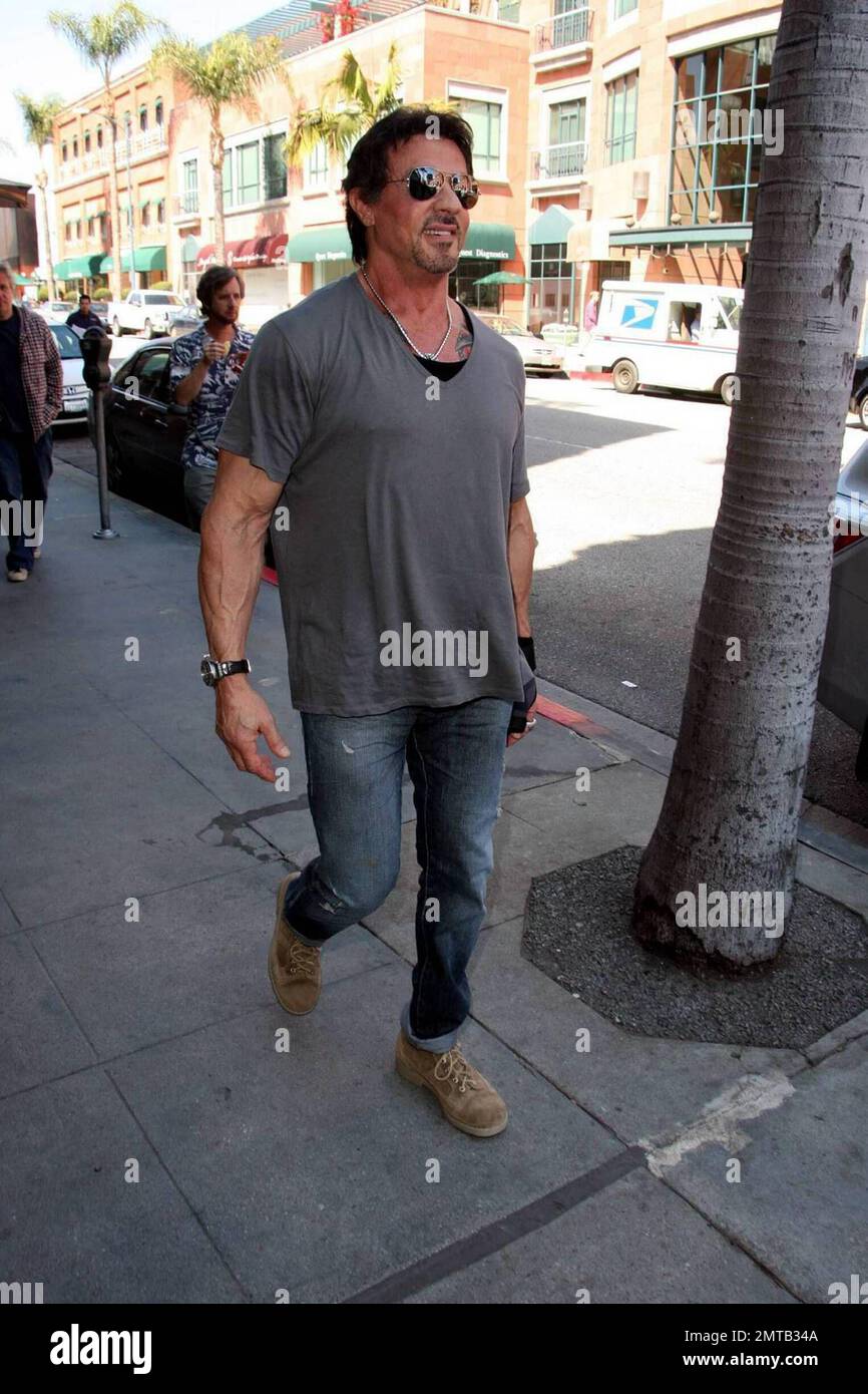 Actor Sylvester Stallone wears a brace around his wrist and thumb to ...
