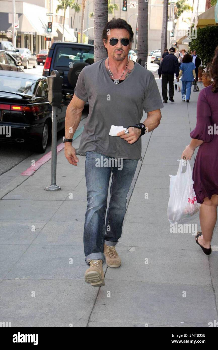 Actor Sylvester Stallone wears a brace around his wrist and thumb to ...