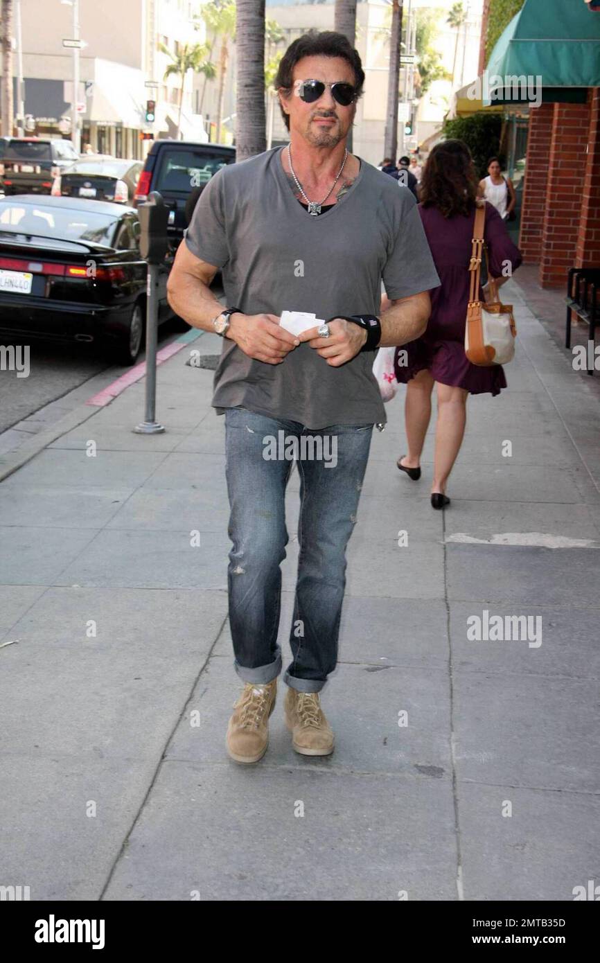 Actor Sylvester Stallone wears a brace around his wrist and thumb to ...