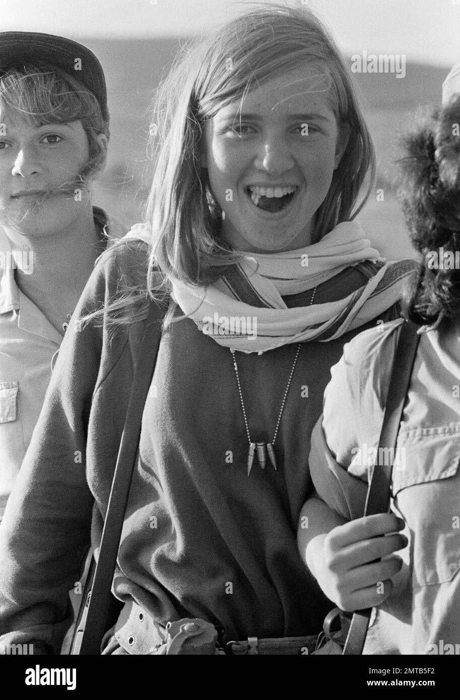 A 15-year-old Israeli high school girl laughs while training with other ...