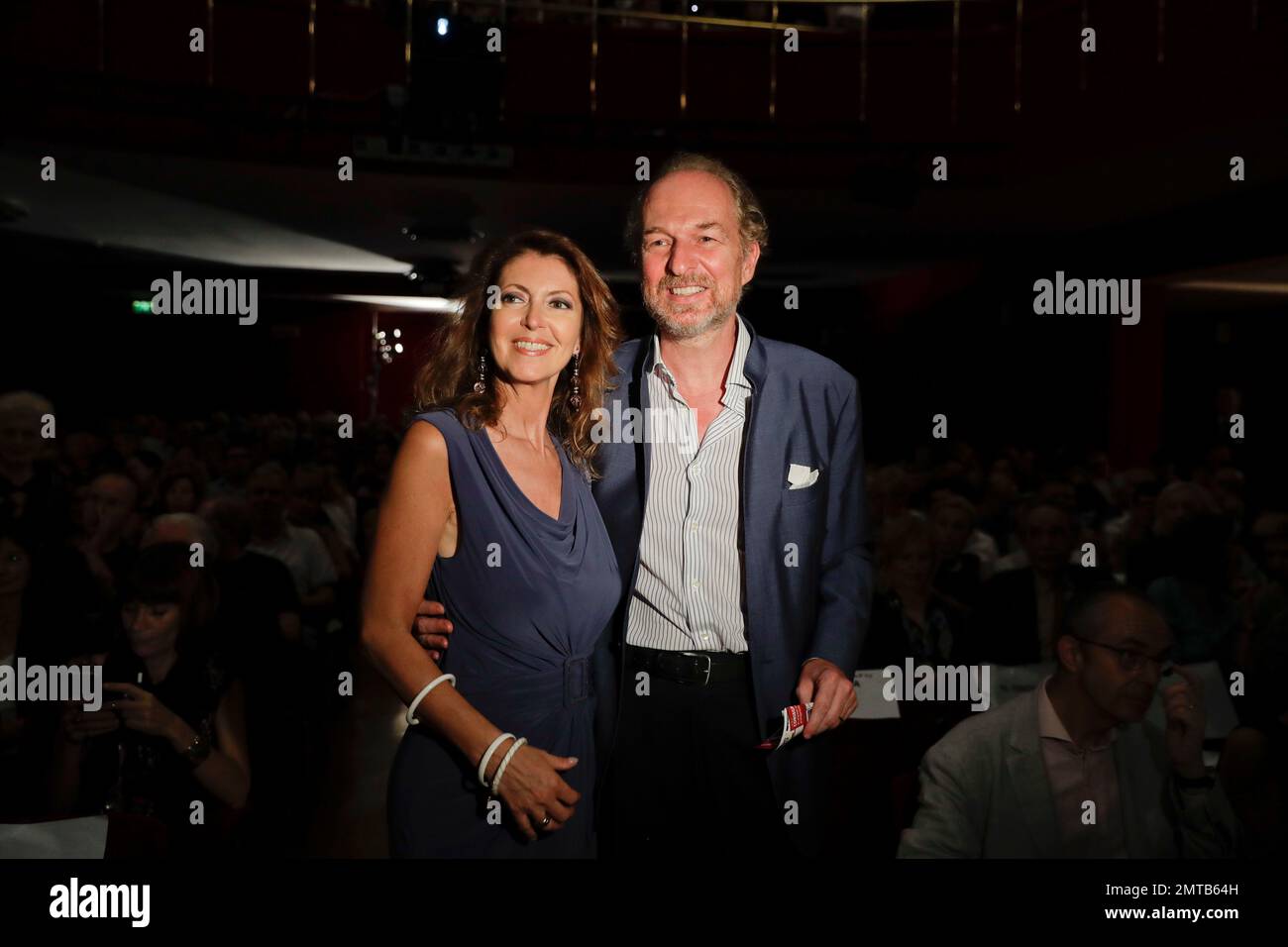 Italian entrepeneur Arturo Artom is flanked by his wife Alessandra ...