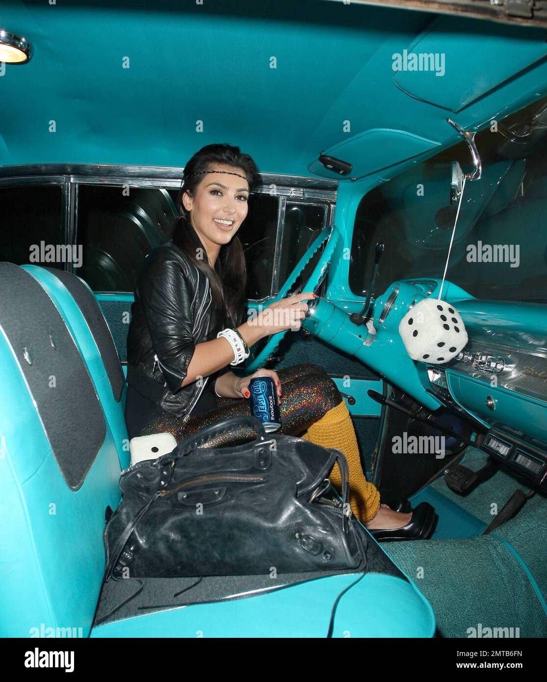 Kim Kardashian poses in an Aqua blue 50's classic car including fluffy ...