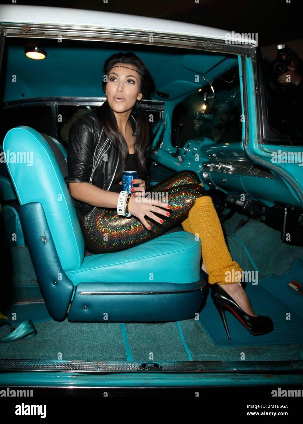 Kim Kardashian poses in an Aqua blue 50's classic car including fluffy ...