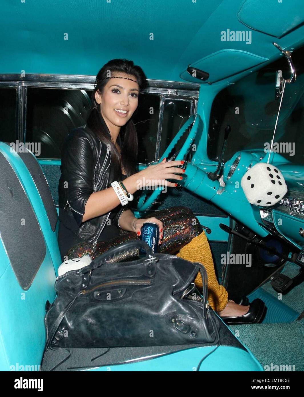Kim Kardashian poses in an Aqua blue 50's classic car including fluffy ...