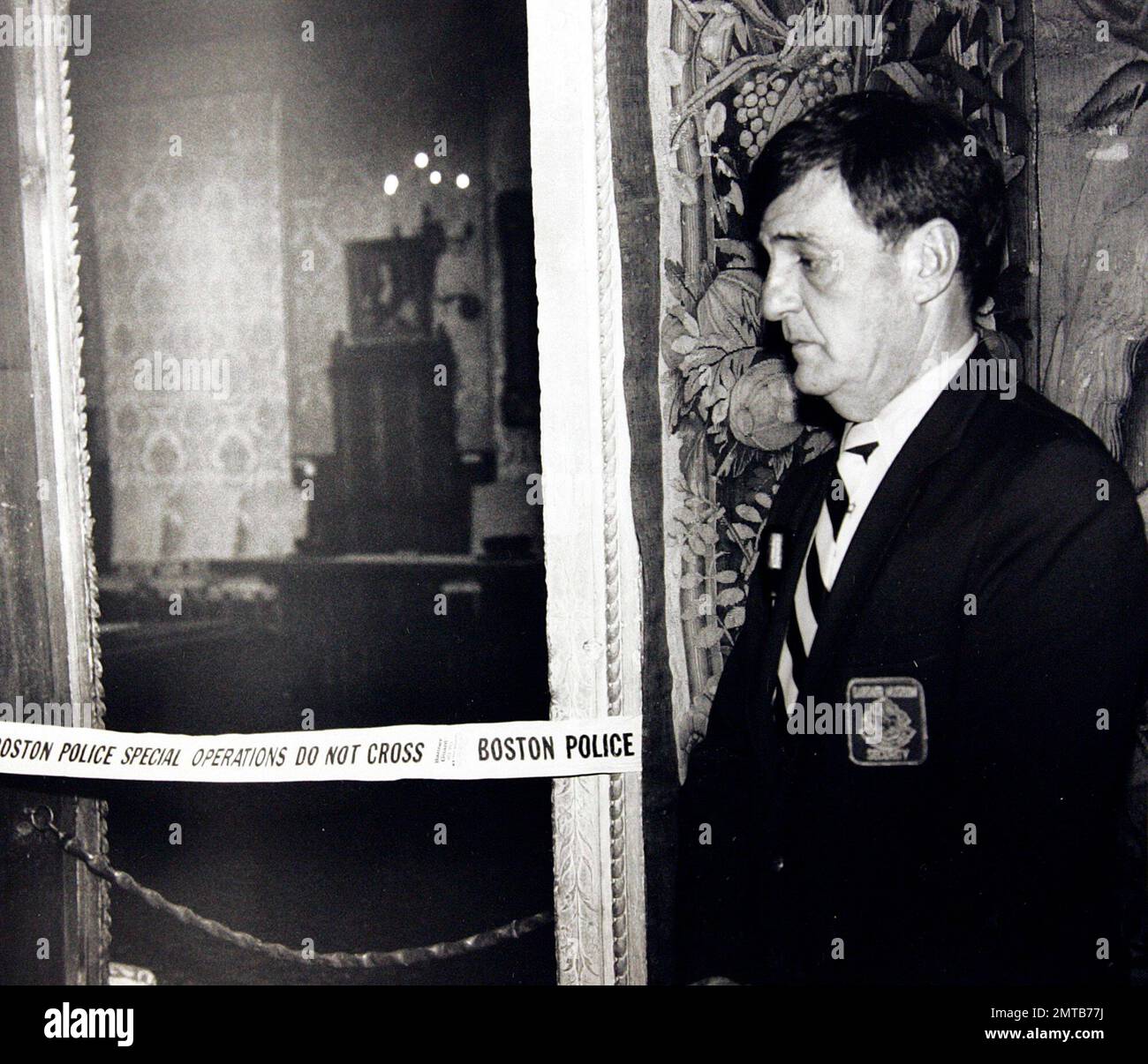 FILE - In this March 21, 1990 file photo, a security guard stands ...