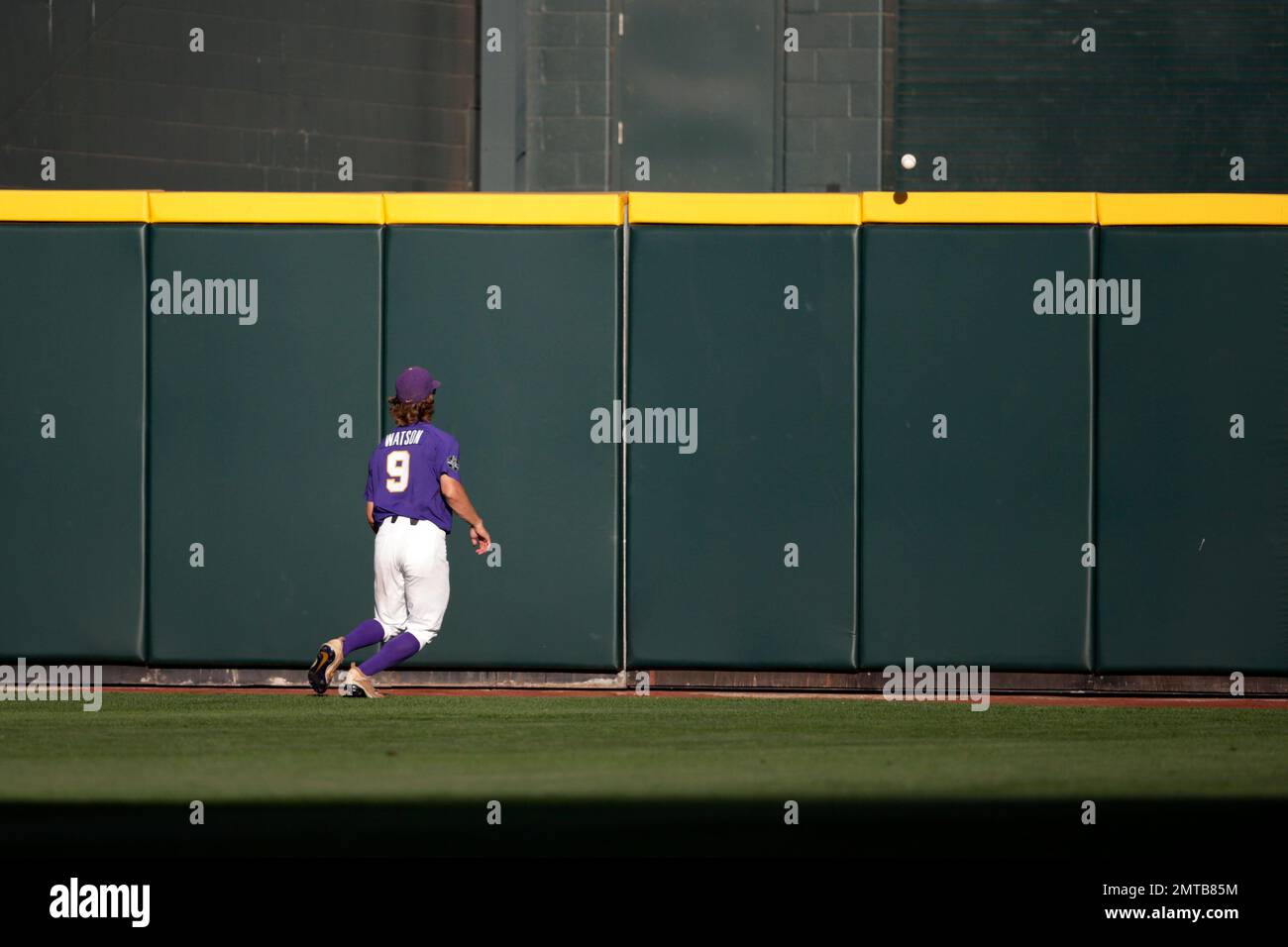 LSU center fielder Zach Watson (9) watches a ground rule double go over ...