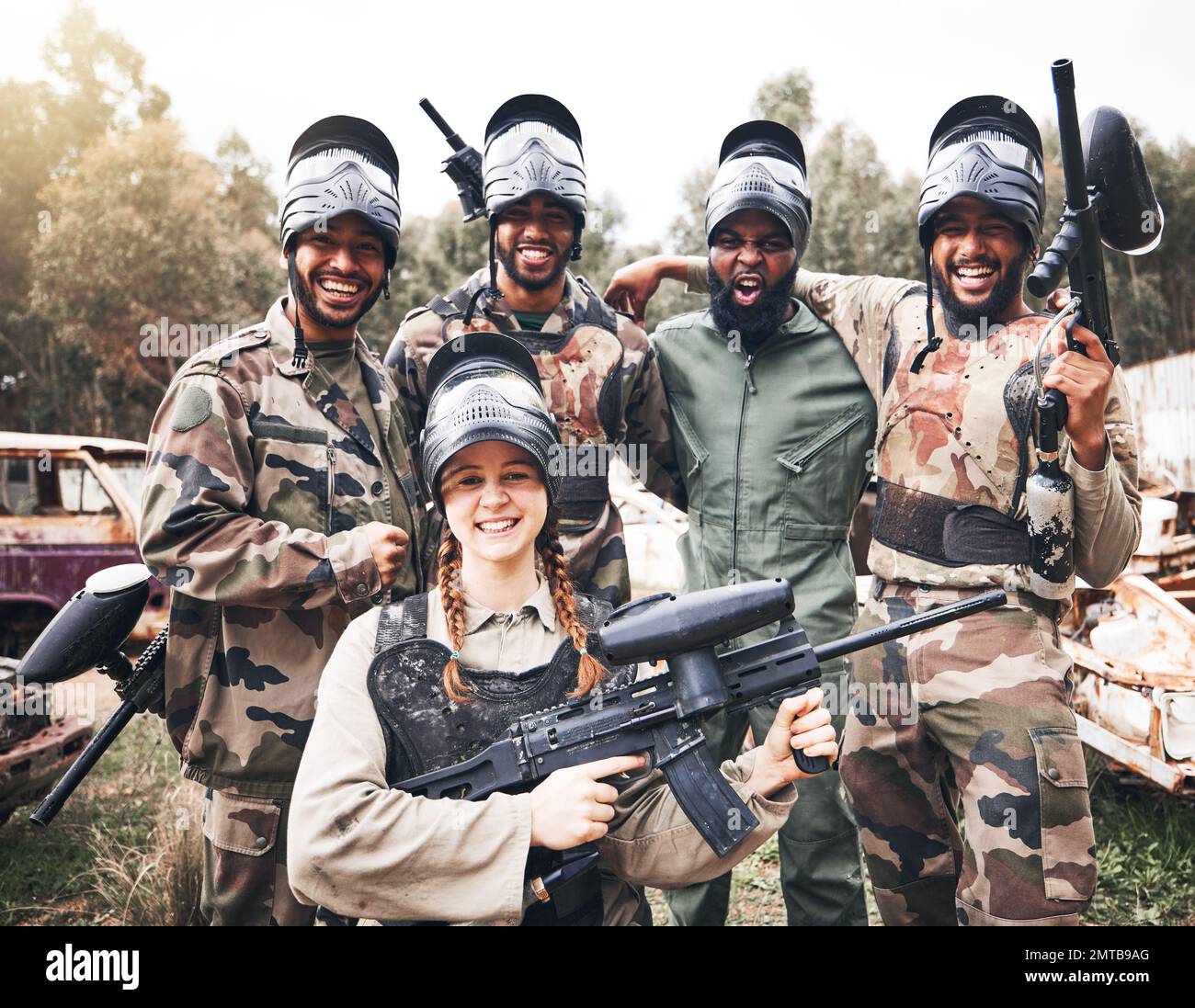 Diversity, portrait and military group with paintball gun for training ...