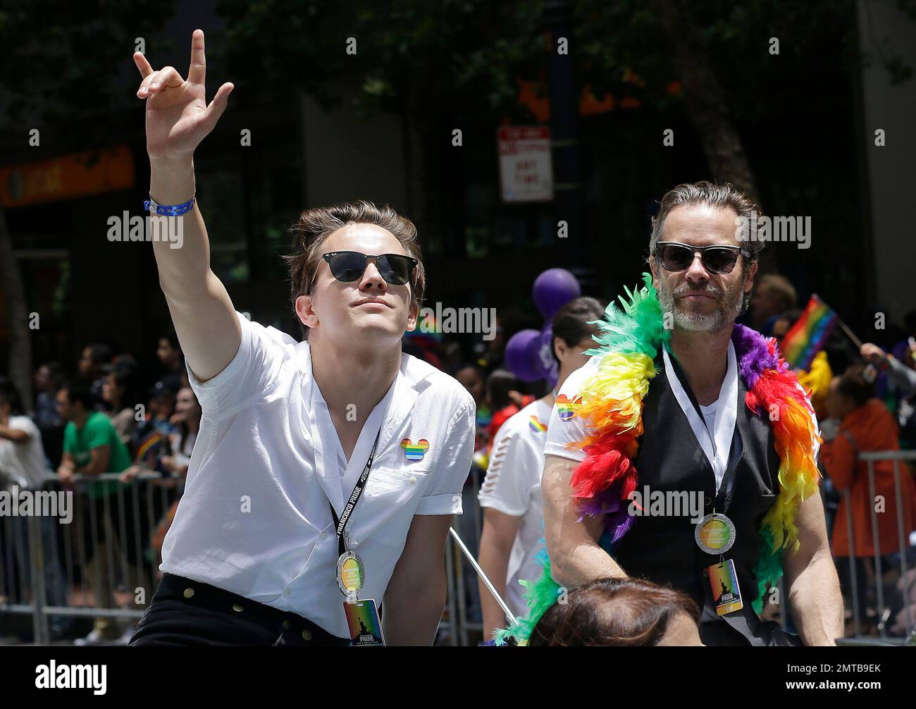 Actors Austin McKenzie, left, and Guy Pearce ride during the Pride ...