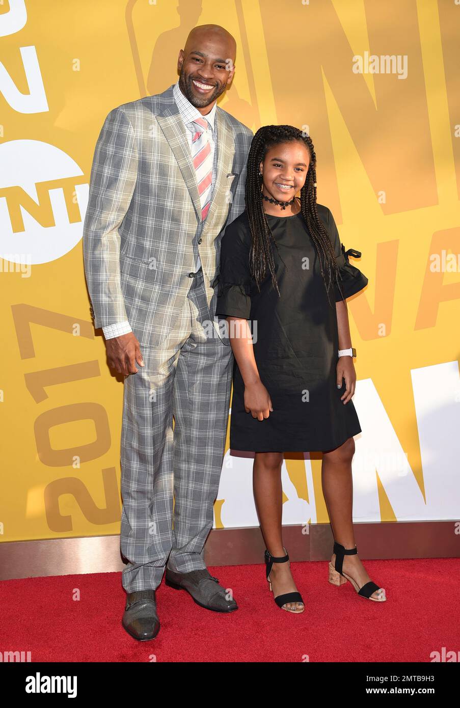 NBA player Vince Carter, of the Memphis Grizzlies, left, and Kai ...