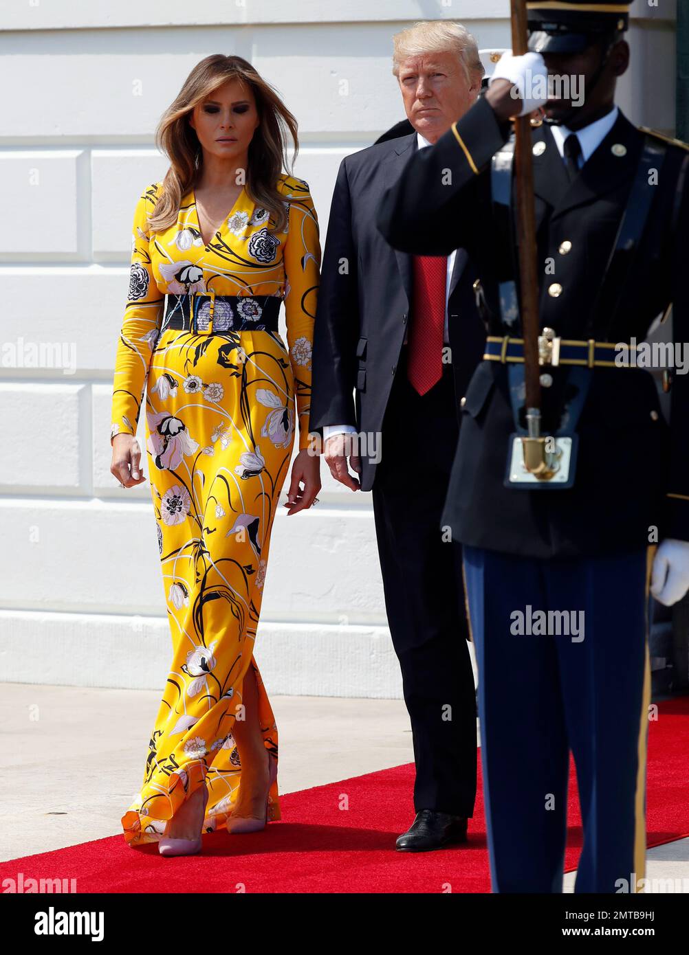 First lady Melania Trump, left, and President Donald Trump walk to ...